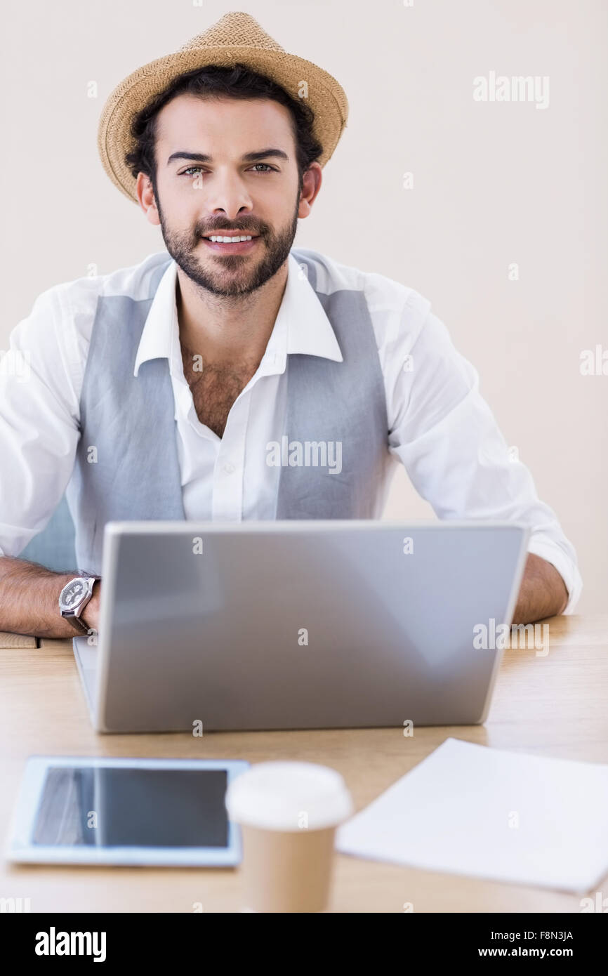 Portrait of smiling man using laptop Stock Photo - Alamy