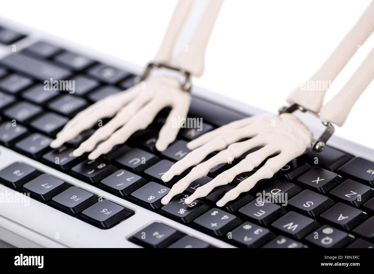 Skeleton working on the keyboard Stock Photo - Alamy