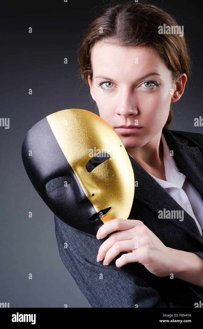 Woman with mask in hypocrisy concept Stock Photo - Alamy