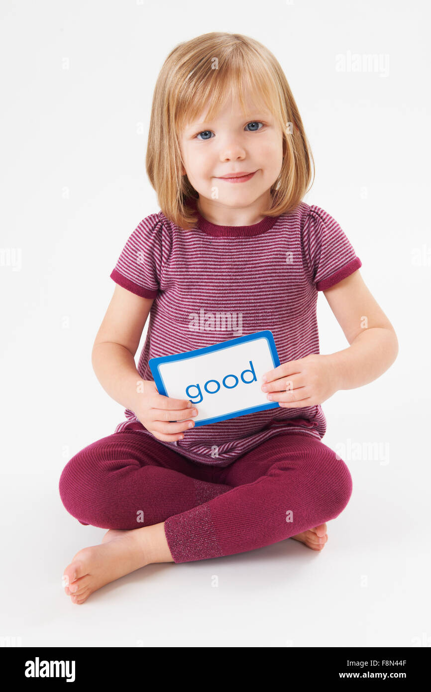 Young Girl In Studio Learning To Read Using Flash Card Stock Photo - Alamy