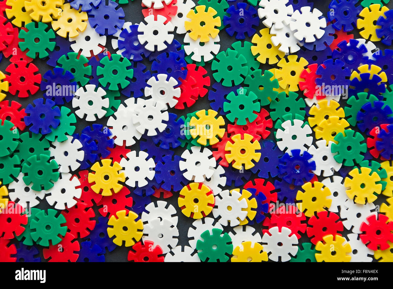 A background of colourful toy tokens Stock Photo - Alamy