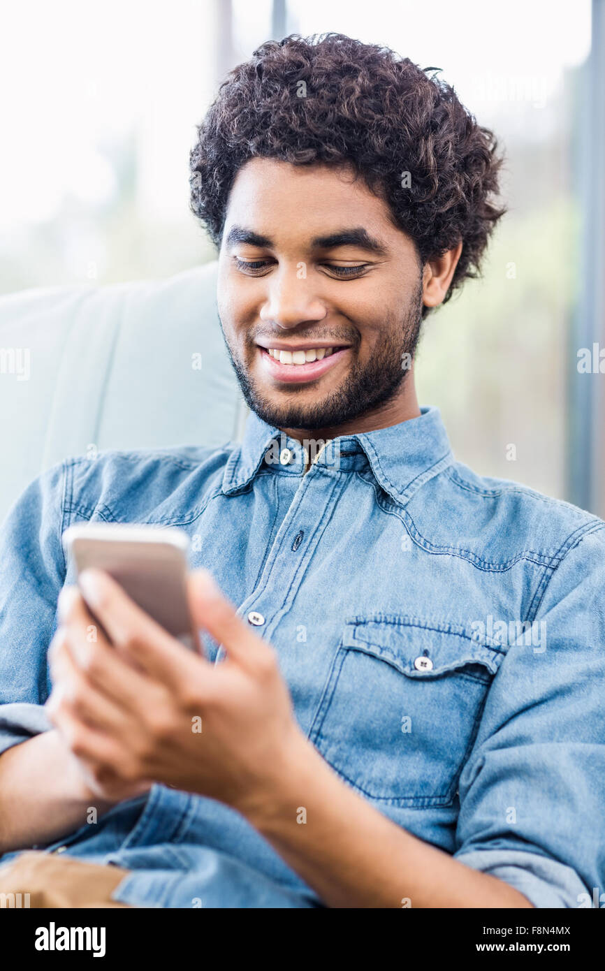 Handsome smiling man typing hi-res stock photography and images - Alamy