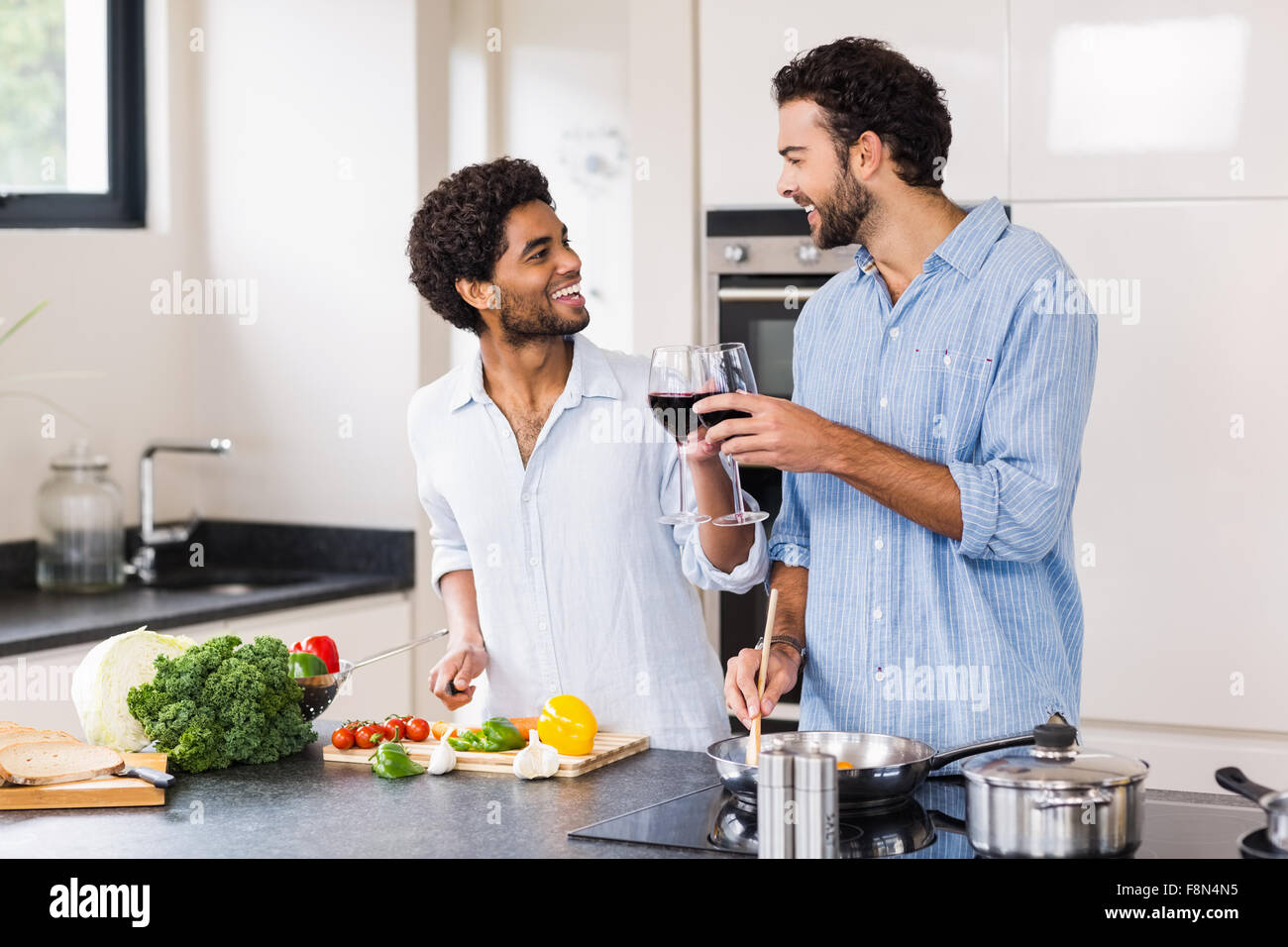 Gay Couple Cooking Together High Resolution Stock Photography and ...