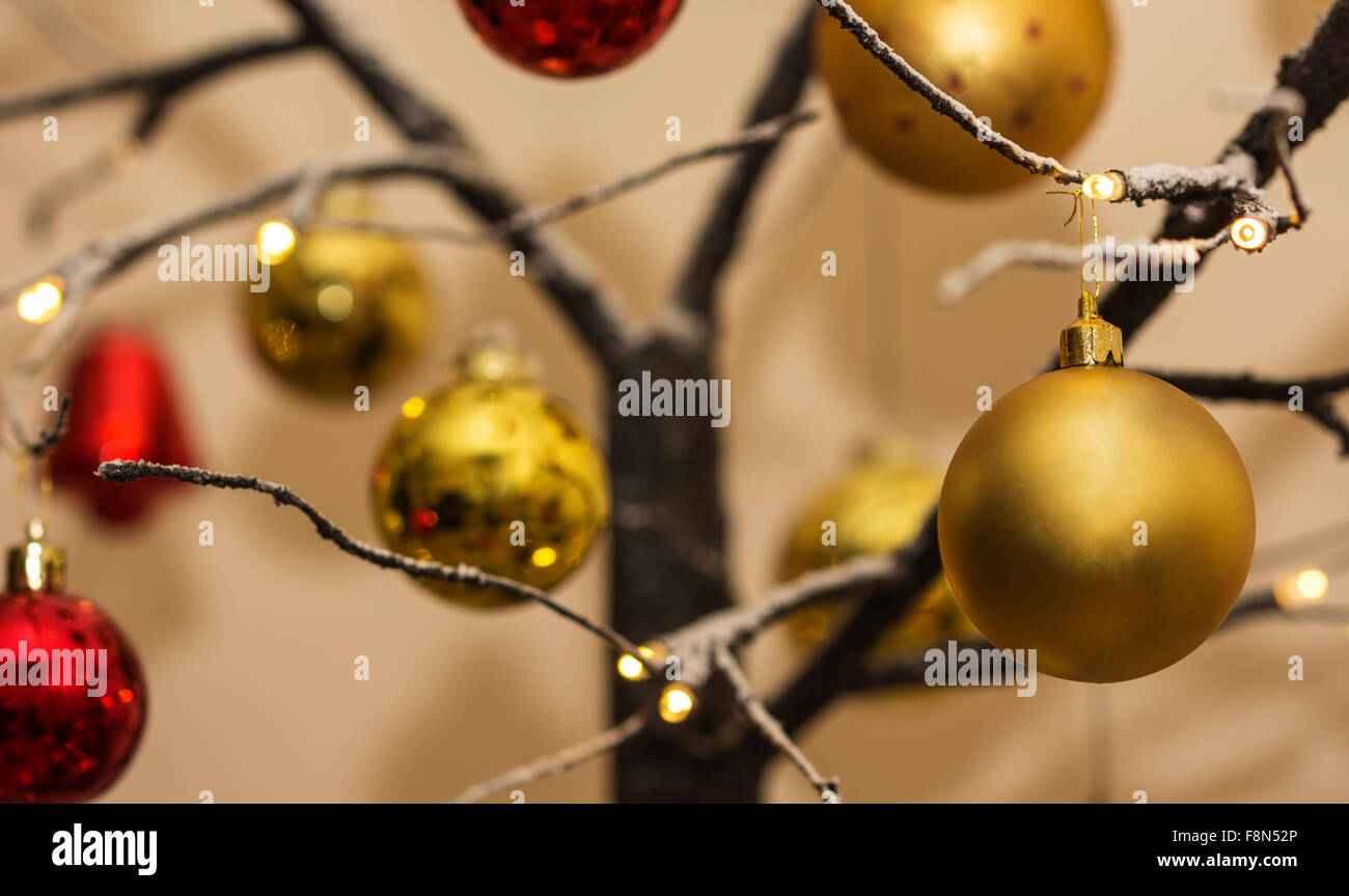 Christmas decorations hanging from contemporary christmas tree Stock ...