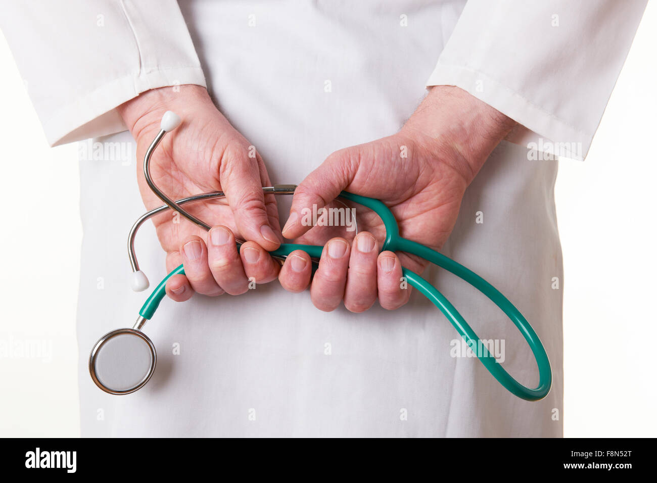 Close Up Of Doctor Holding Stethoscope Behind Back Stock Photo - Alamy