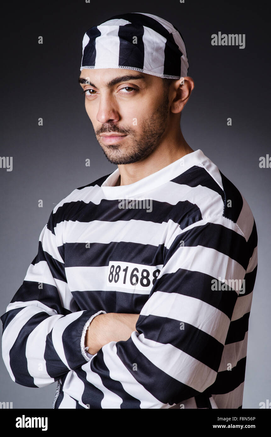 Convict criminal in striped uniform Stock Photo - Alamy