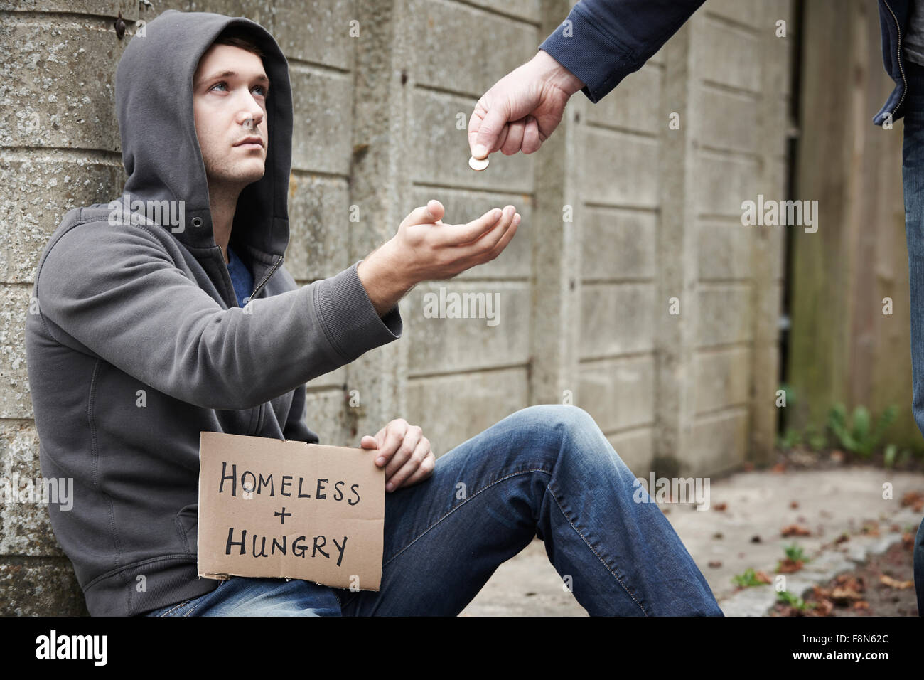 Giving to the homeless hi-res stock photography and images - Alamy
