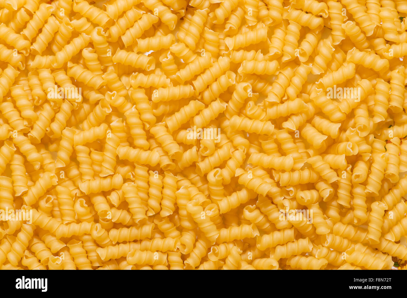 Close up of italian pasta - spiral shaped Stock Photo - Alamy