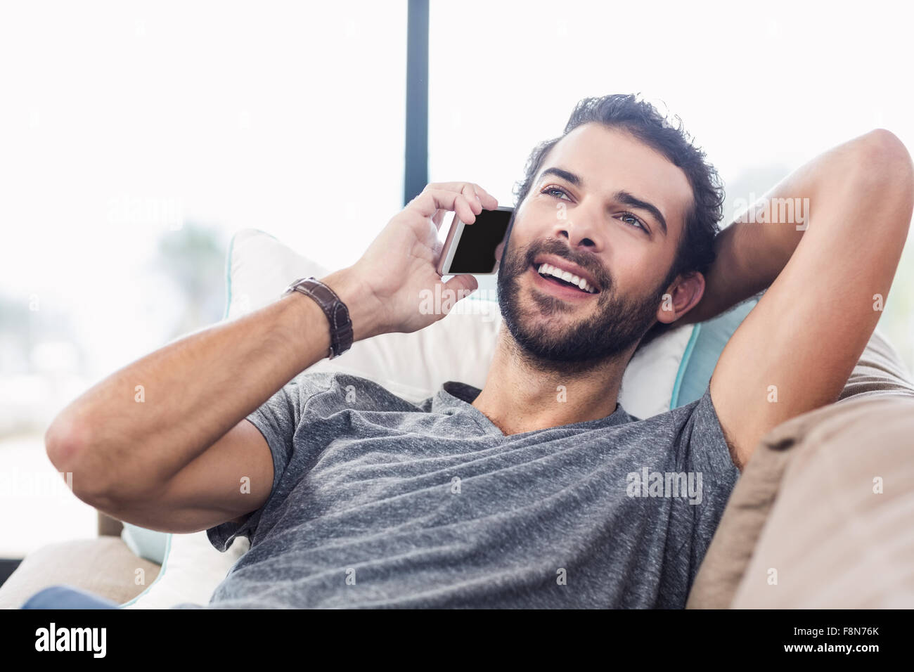 Attractive man on phone call Stock Photo - Alamy