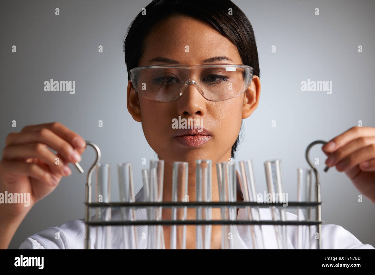 Laboratory scientist holding test tubes hi-res stock photography and ...