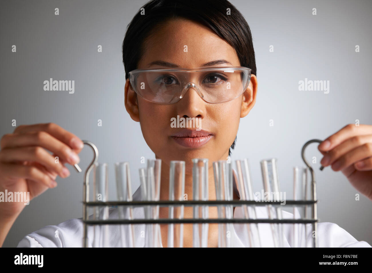 Female Scientist Examines Test Tubes Stock Photo - Alamy