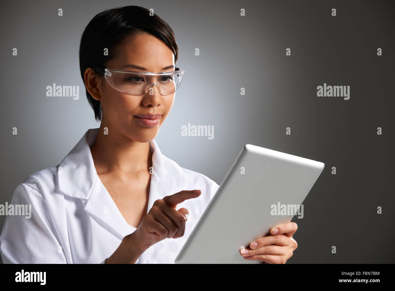 Studio Portrait Of Female Laboratory Worker With Digital Tablet Stock ...