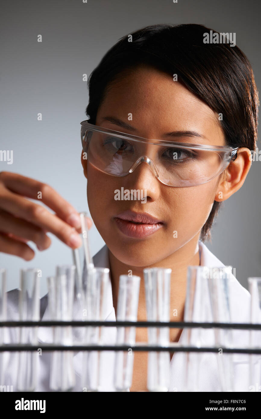 Female Scientist Examines Test Tubes Stock Photo - Alamy