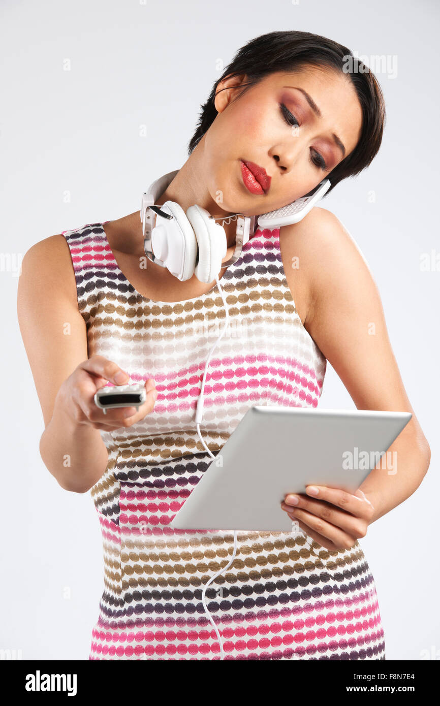 Woman Holding Selection Of Digital Devices Stock Photo - Alamy