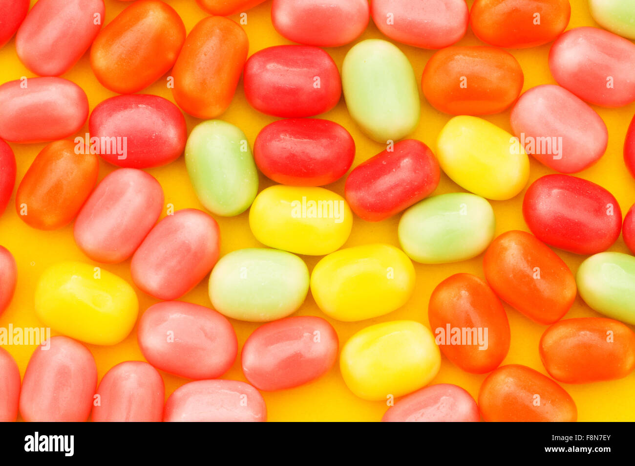 Various dry colourful sweets arranged as background Stock Photo - Alamy