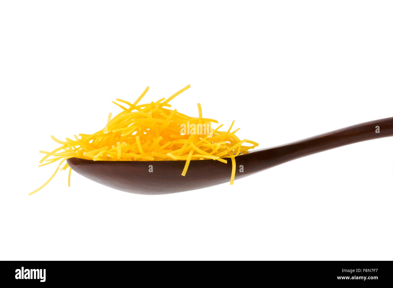 Spaghetti in wooden spoon isolated on white Stock Photo - Alamy