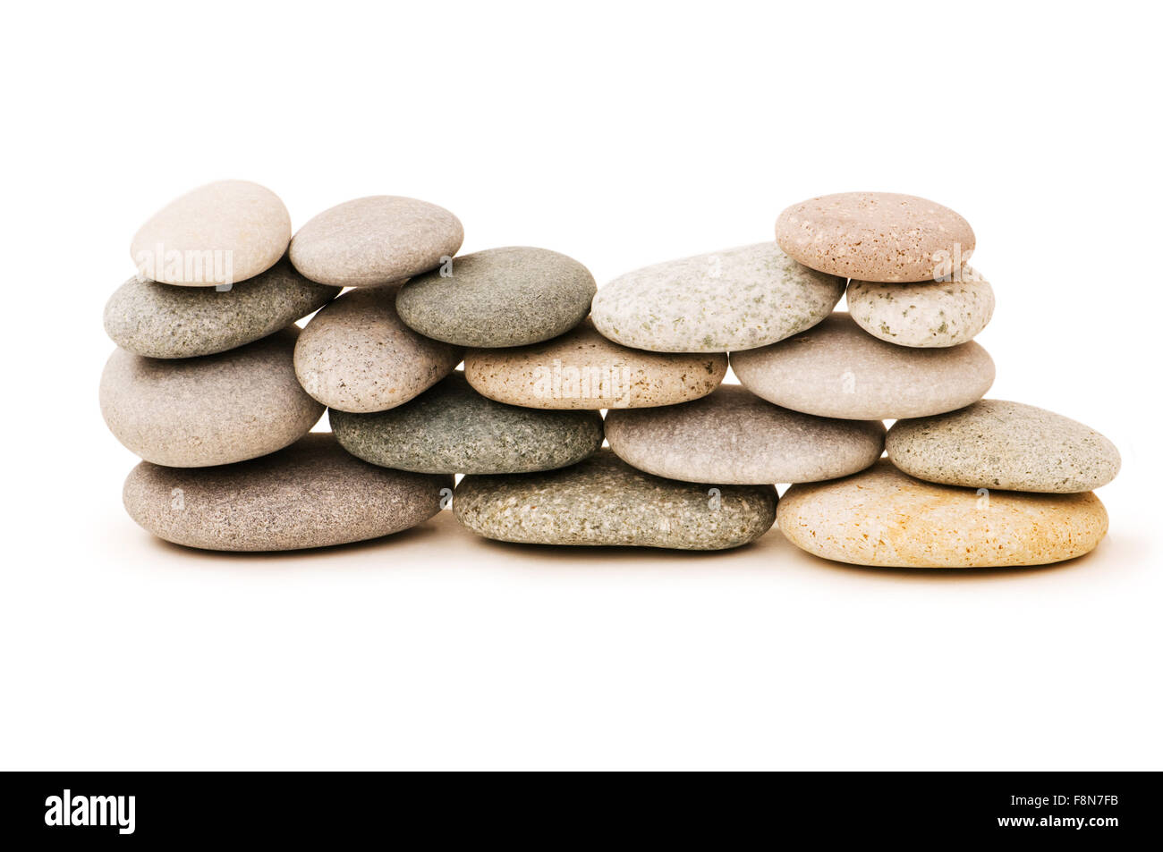 Stack of pebbles isolated on the white background Stock Photo - Alamy
