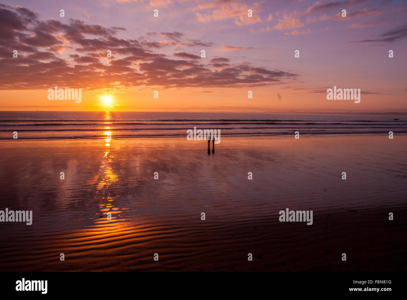 Red sunset over water on a beach Stock Photo - Alamy
