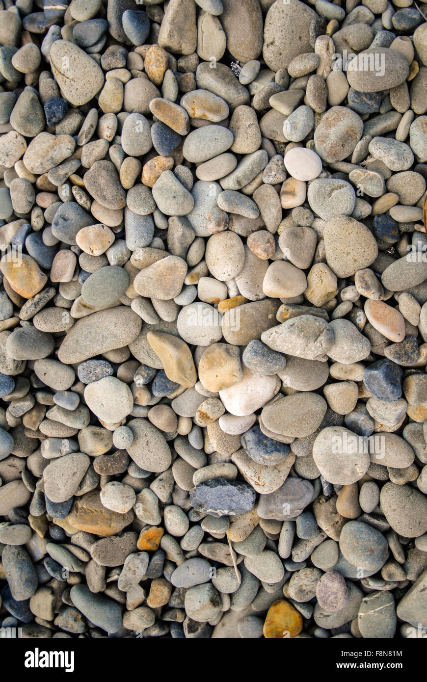 Collection of smooth stones on a beach Stock Photo - Alamy