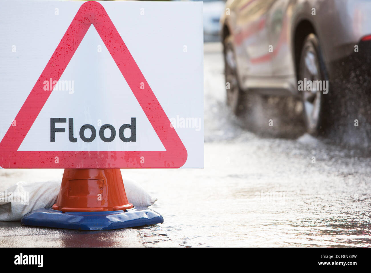 Warning Traffic Sign On Flooded Road With Cars Stock Photo - Alamy