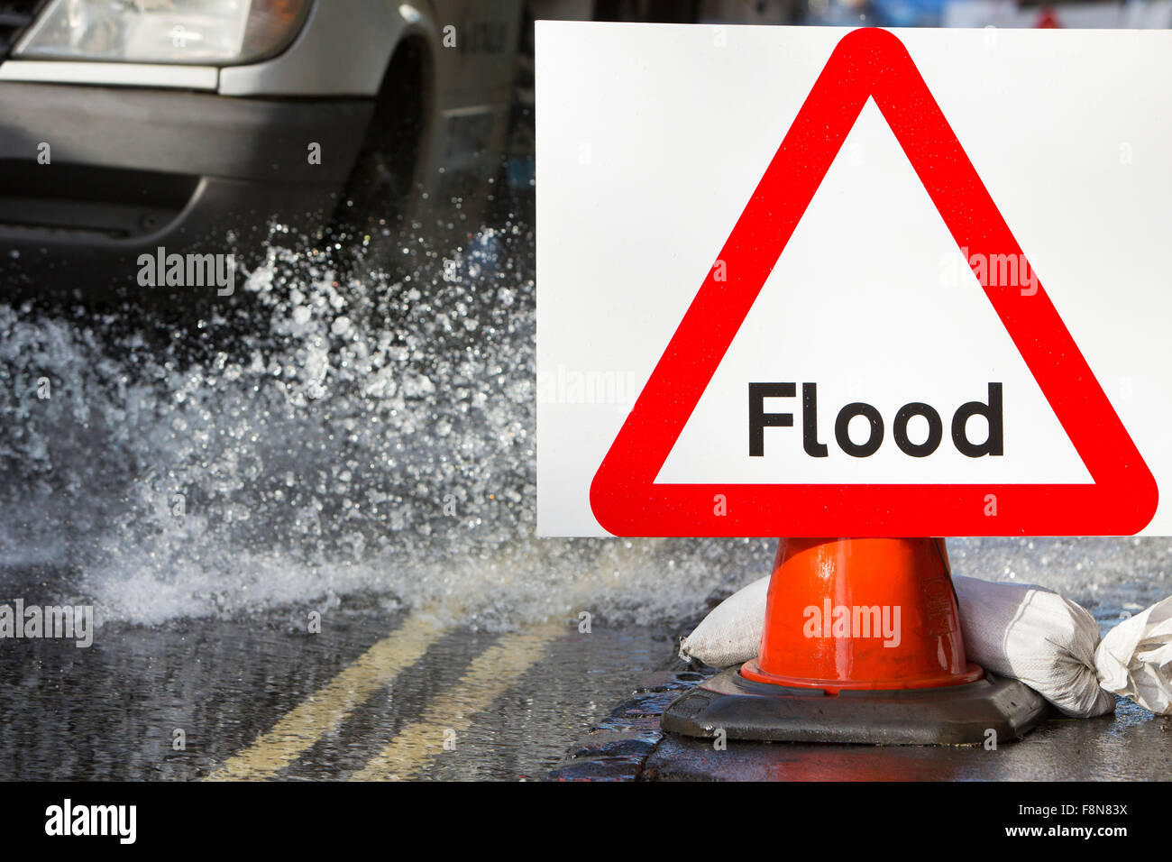 Warning Traffic Sign On Flooded Road With Cars Stock Photo - Alamy