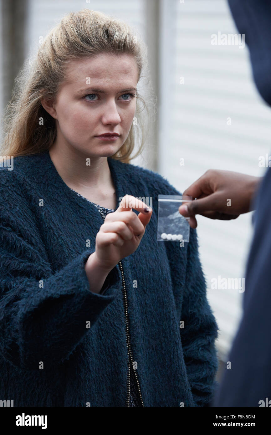 Teenage Girl Buying Drugs On The Street Stock Photo - Alamy