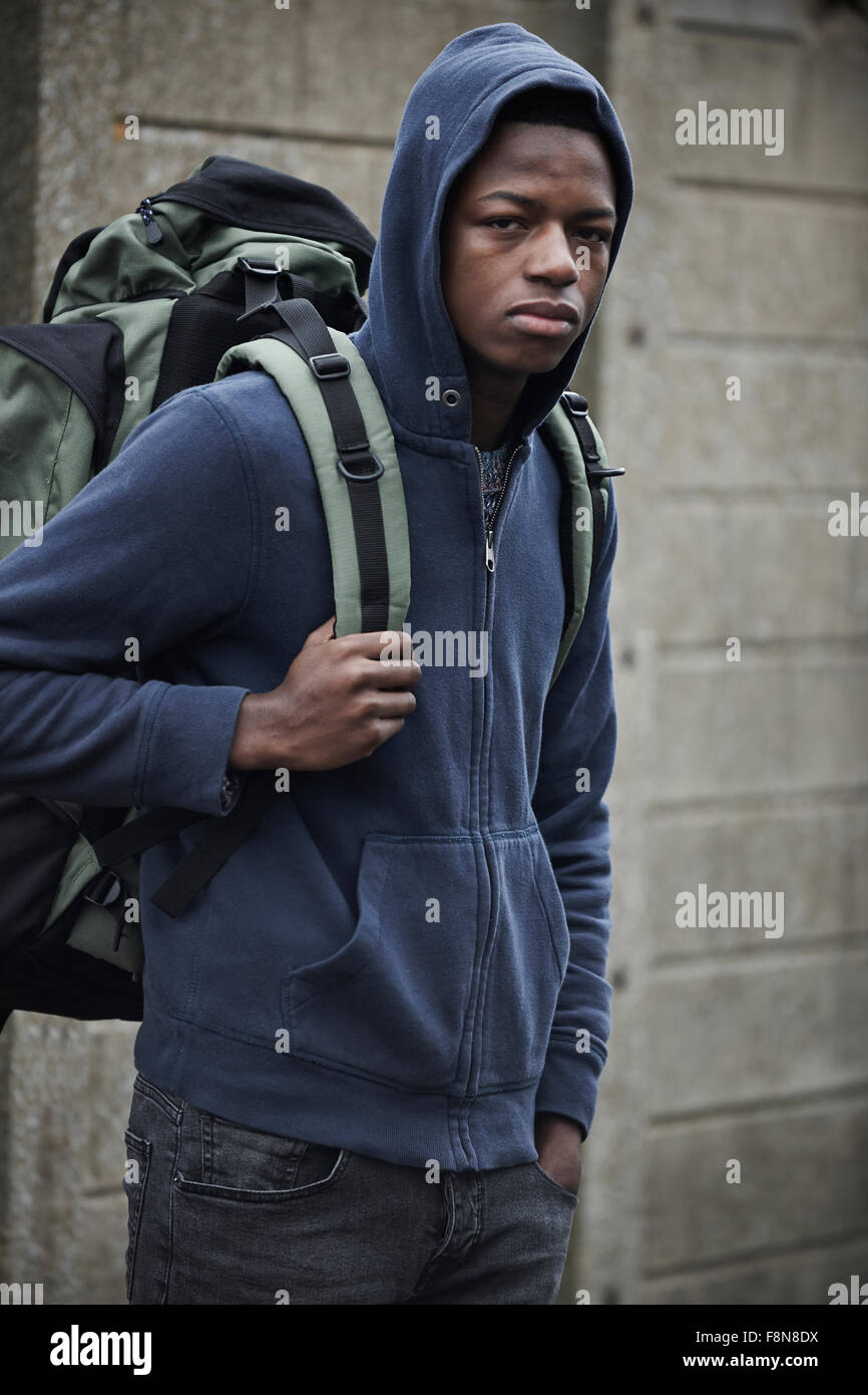 Homeless Teenage Boy On Streets With Rucksack Stock Photo - Alamy