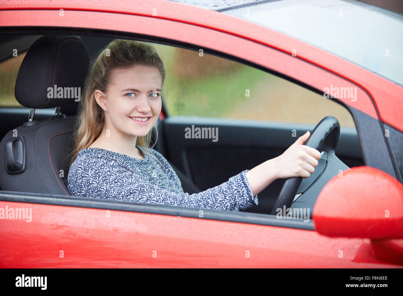 Newly Qualified Teenage Girl Driver Sitting In Car Stock Photo - Alamy