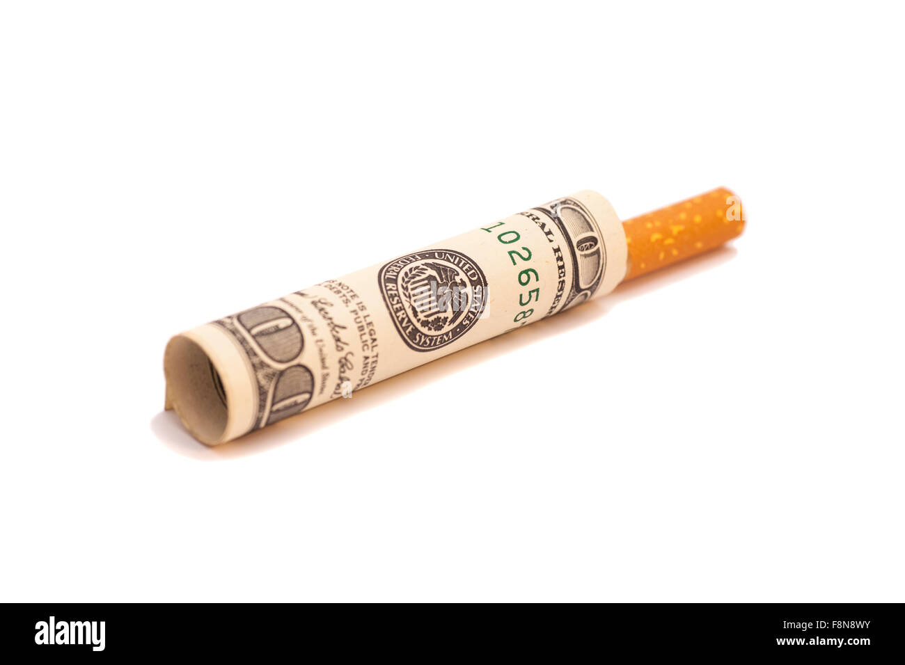 Cigarette and money on white background Stock Photo - Alamy