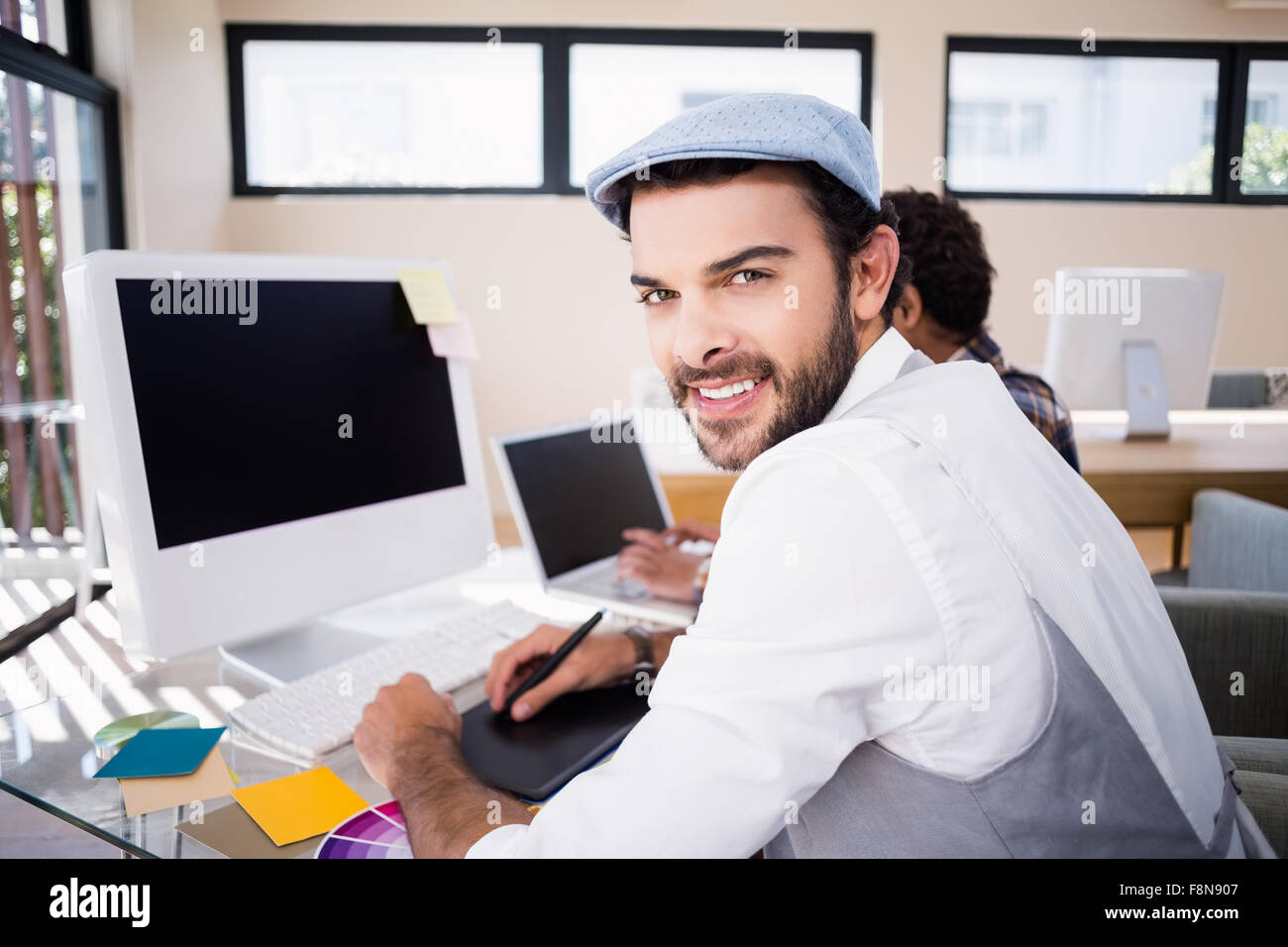 Smiling man using digital board Stock Photo - Alamy