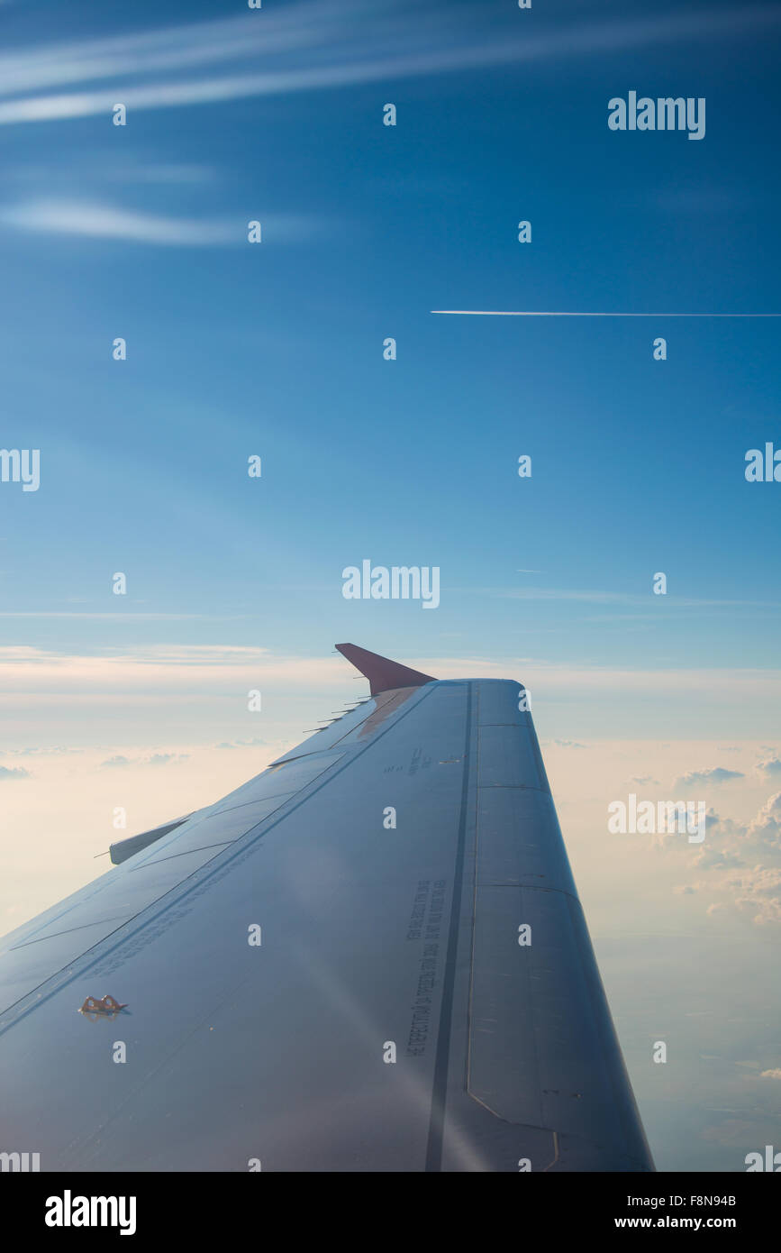 Airplane wing out of window Stock Photo - Alamy