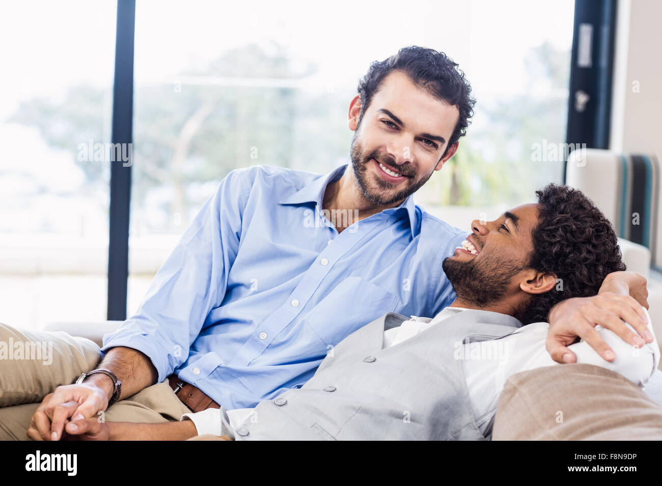 Gay couple sofa hi-res stock photography and images - Alamy