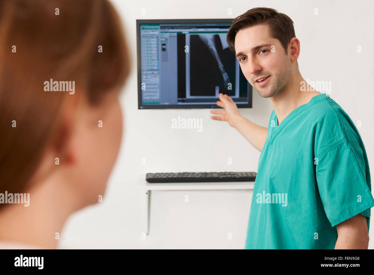 Vet Discussing Pet X Ray With Owner Stock Photo - Alamy