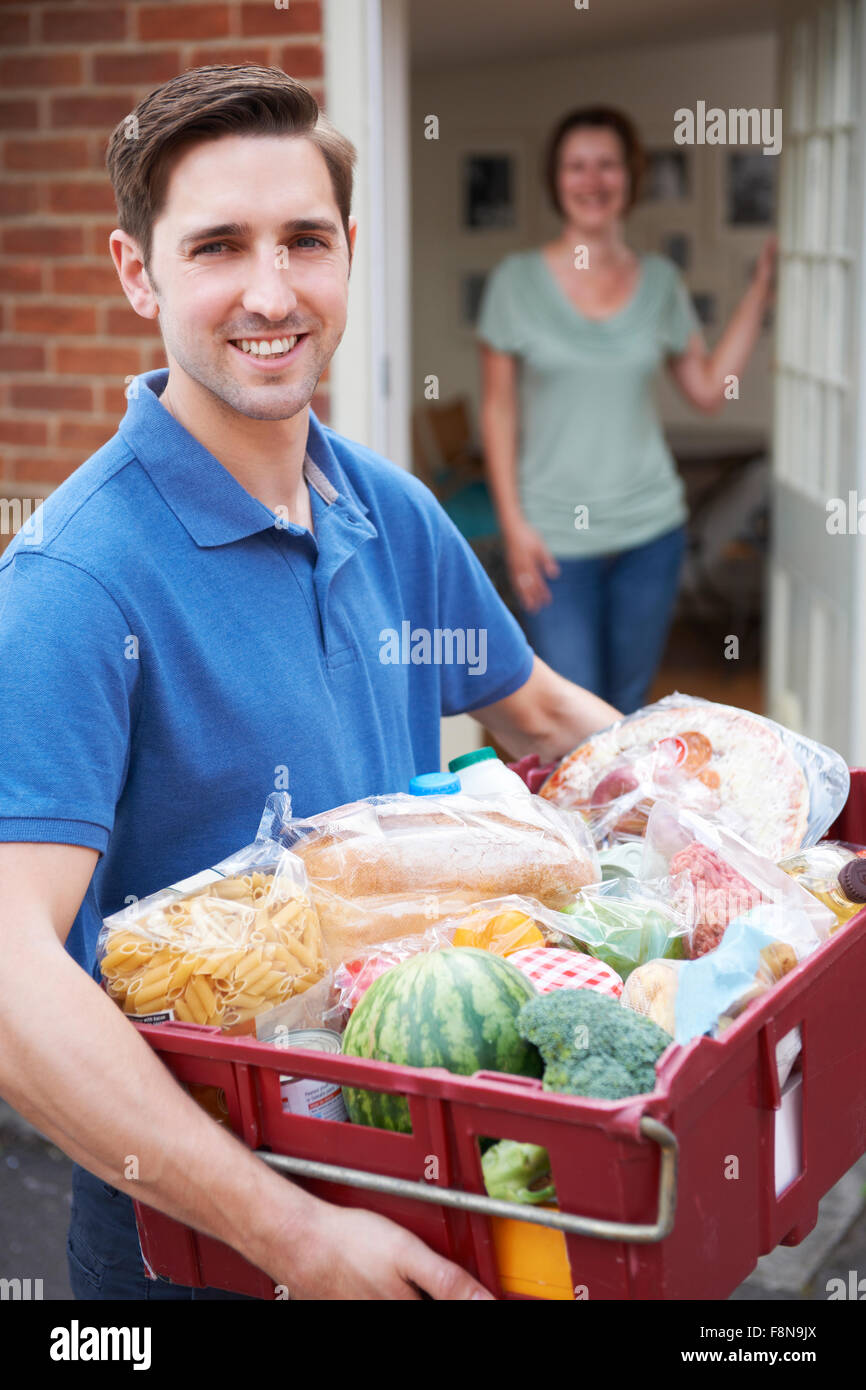 Driver Delivering On line Grocery Order Stock Photo - Alamy