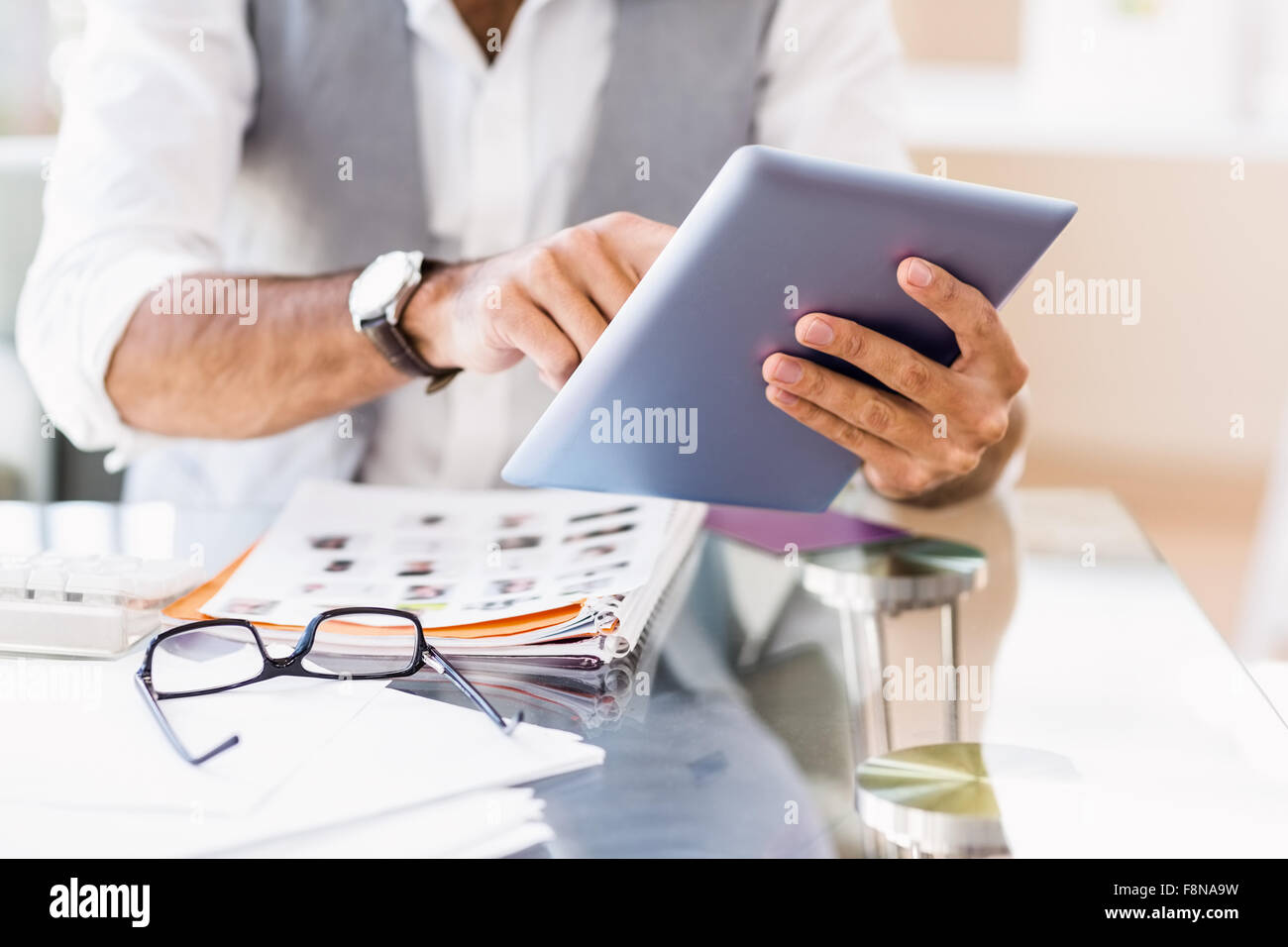 Close up of man using tablet Stock Photo - Alamy