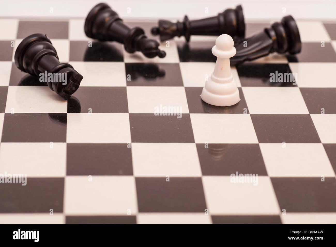 Queen surrounded pawn chess pieces hi-res stock photography and images ...