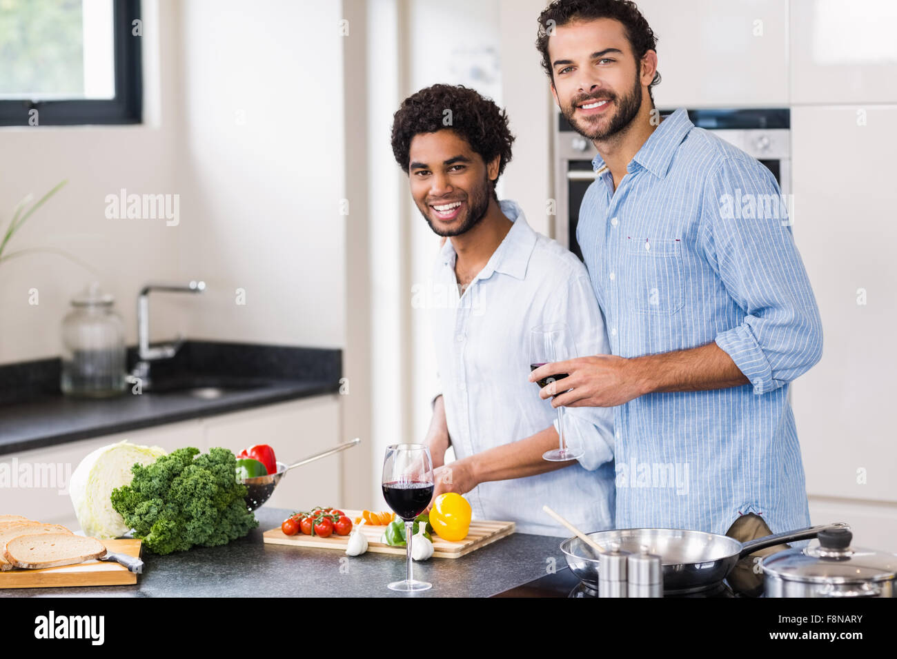 Gay Couple Cooking Together High Resolution Stock Photography and ...