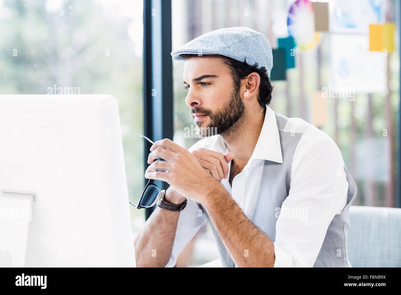 Focused man working on computer Stock Photo - Alamy