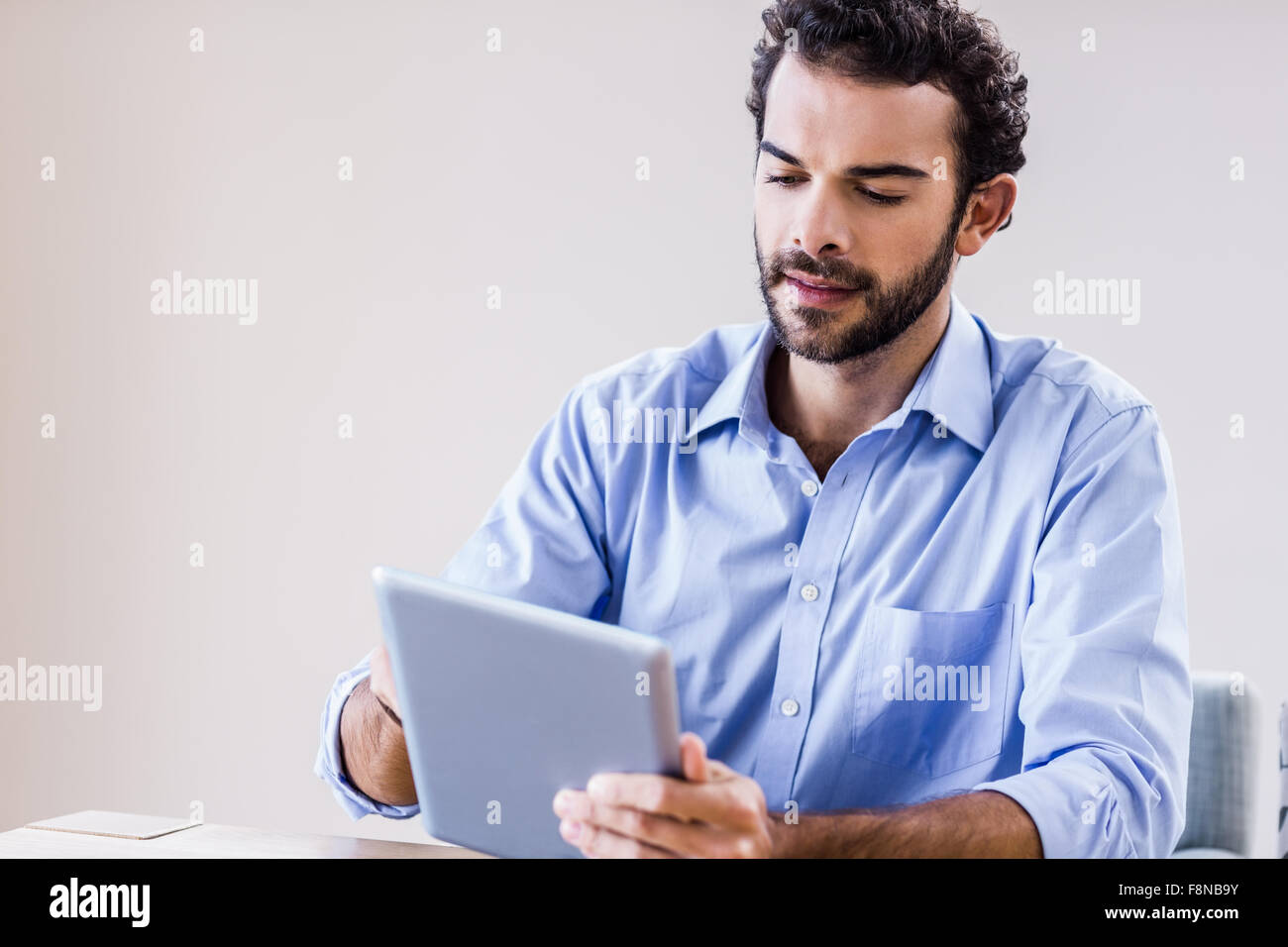 Handsome man using tablet Stock Photo - Alamy