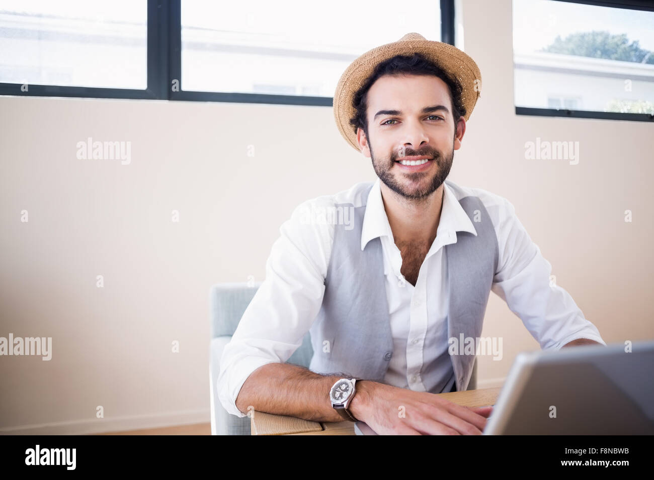 Portrait of smiling man using laptop Stock Photo - Alamy