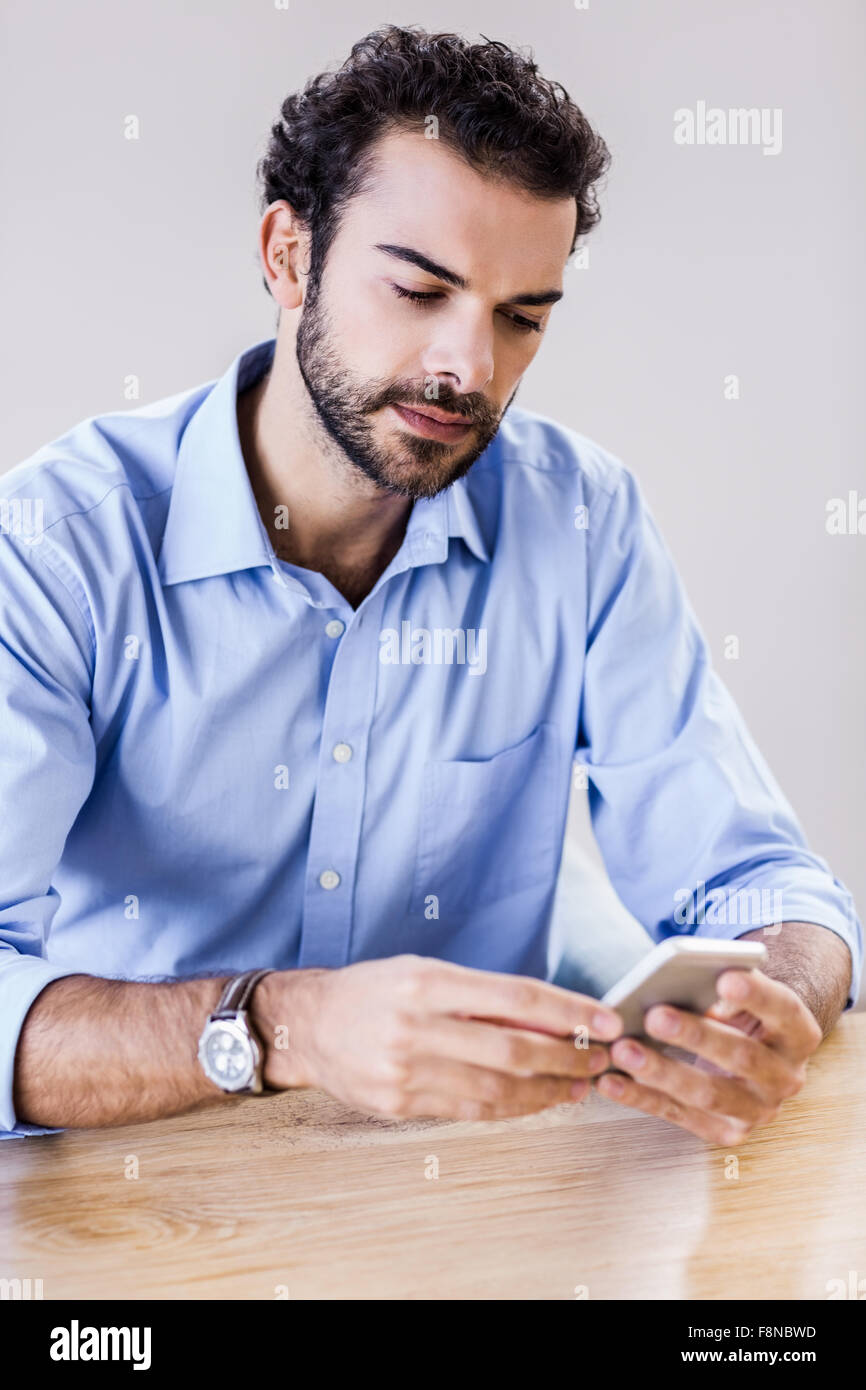 Handsome man using smartphone Stock Photo - Alamy