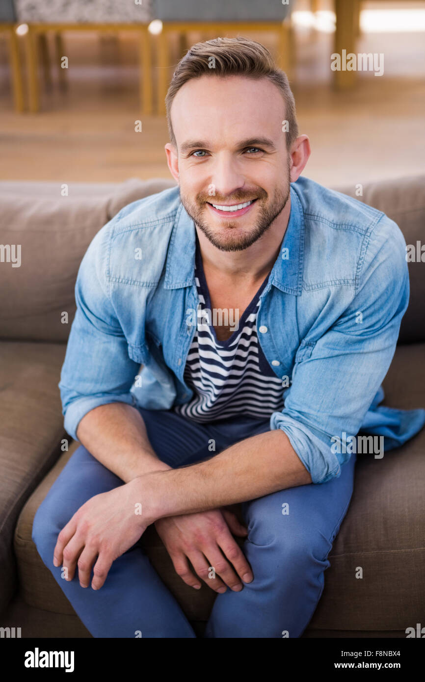 Handsome man smiling at camera Stock Photo - Alamy