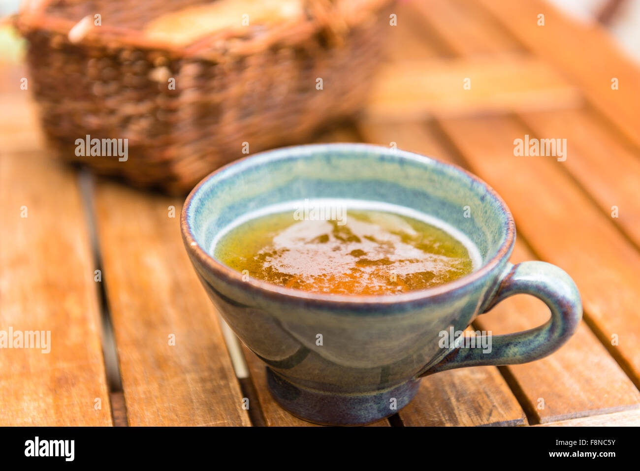 Norman apple cider in a typical ceramic cup. Shot with a selective ...