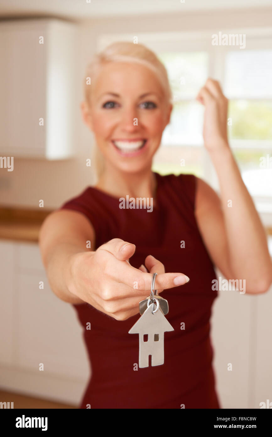 Young Woman Holding Keys To New Home Stock Photo - Alamy