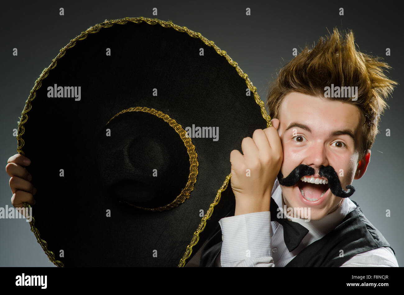Smiling mexican with sombrero isolated on white Stock Photo - Alamy