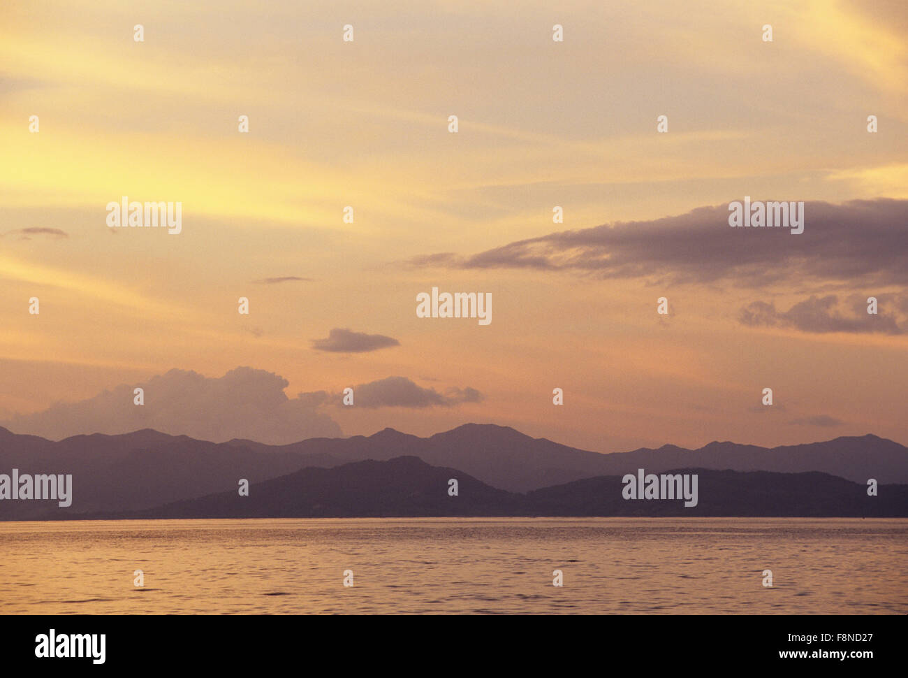 Fiji Islands, Taveuni, Waiyevo sunset w/Vanua Levu in distance Stock ...