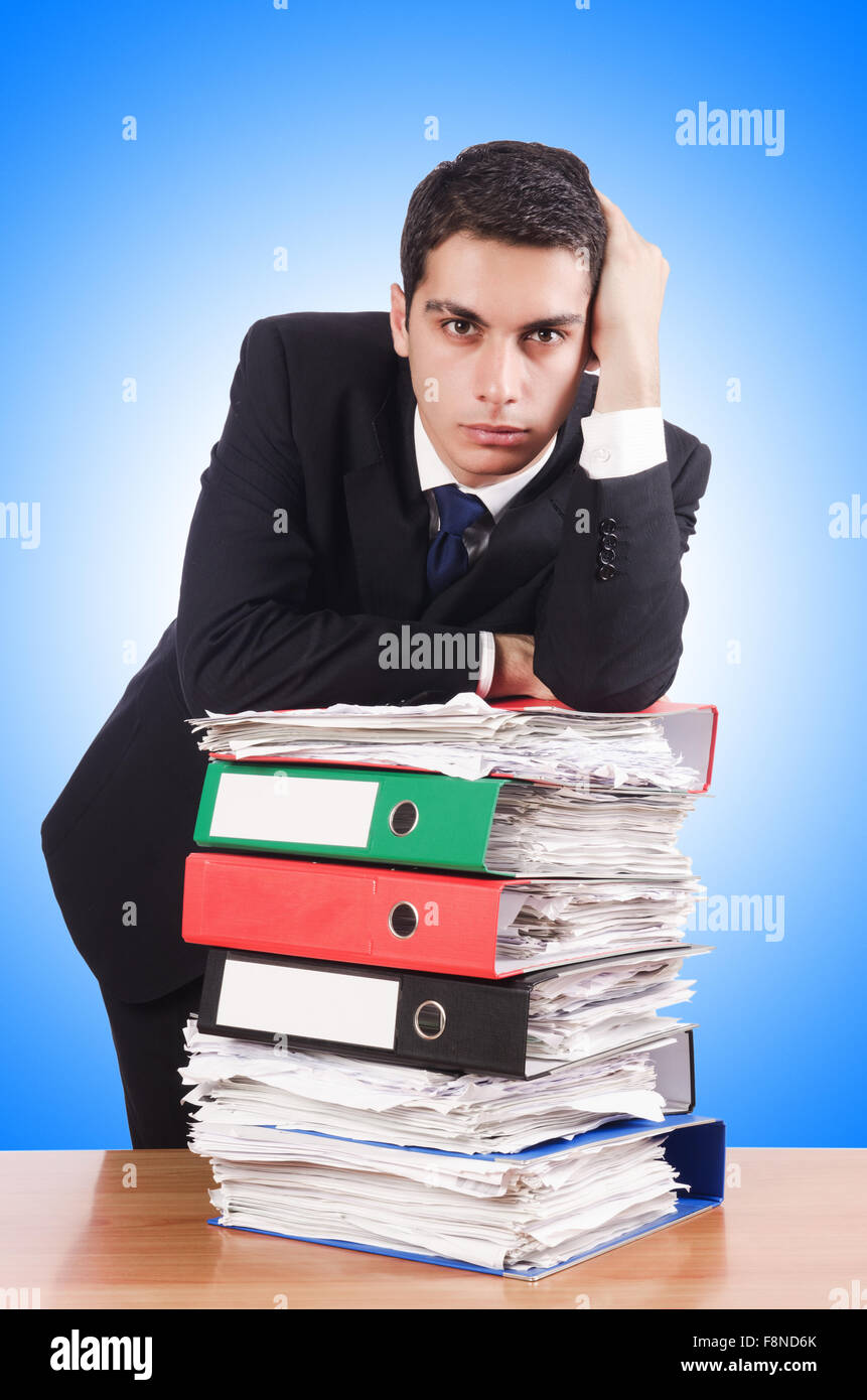 Young busy businessman at his desk Stock Photo - Alamy