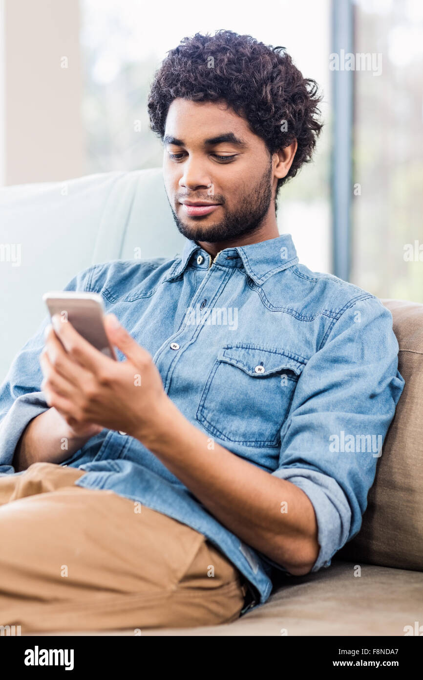 Handsome man using smartphone Stock Photo - Alamy