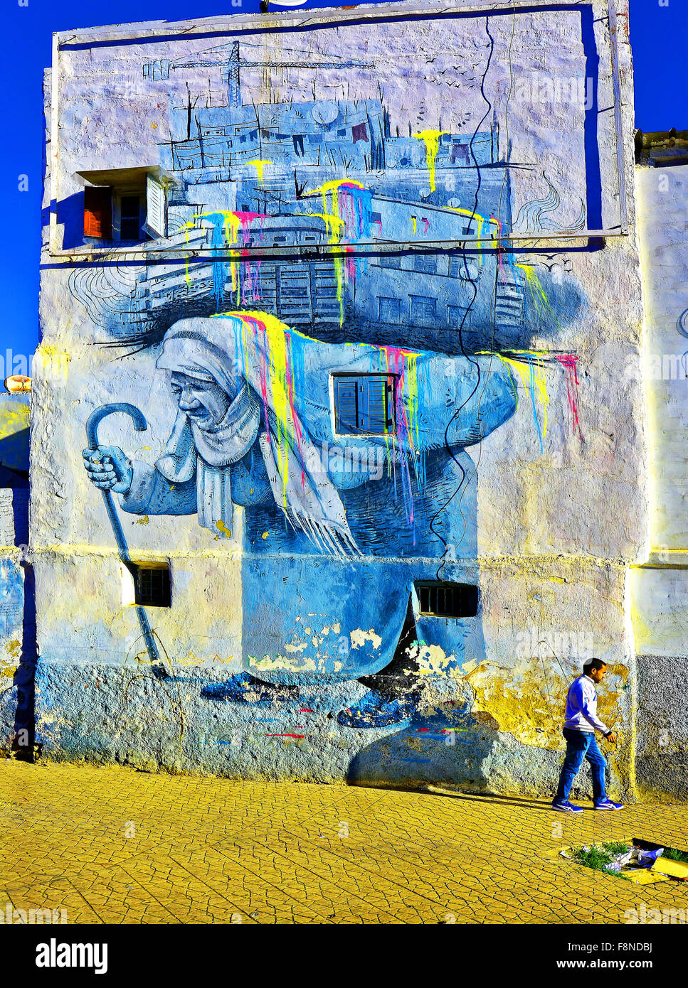 Casablanca Morocco Banksy style wall paintings of old woman Stock Photo ...