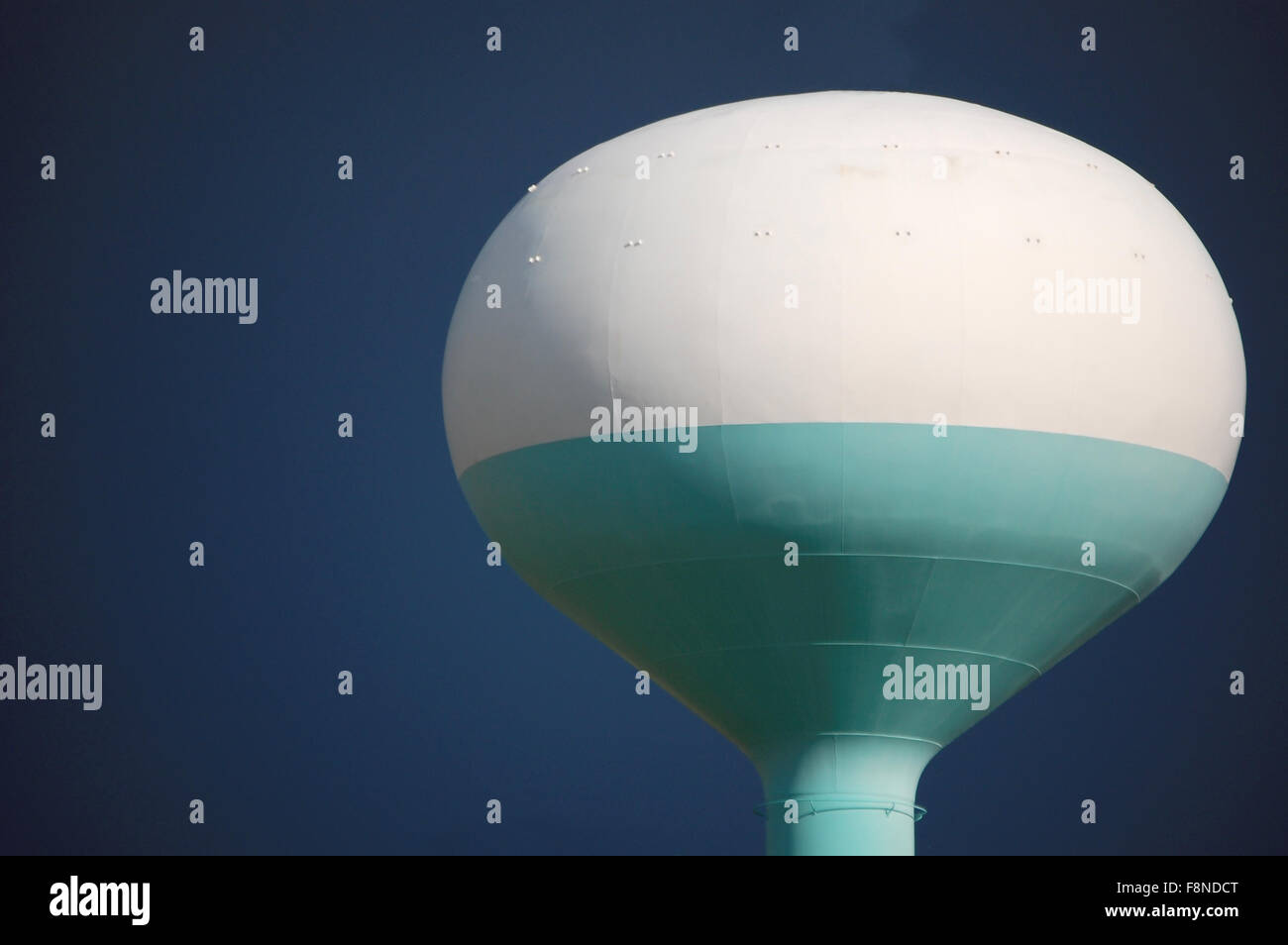 Water storage tank against dark stormy sky Stock Photo - Alamy